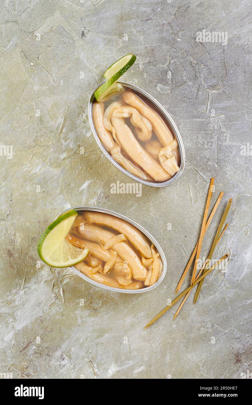 Canned razor clams with lime Stock Photo - Alamy