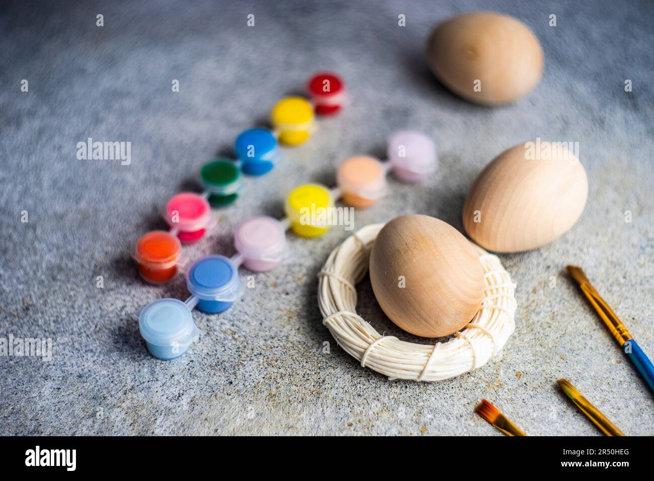 Crafting tools with different colors painting on concrete background ...