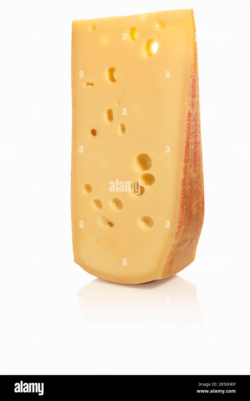 A piece of Emmental cheese Stock Photo - Alamy