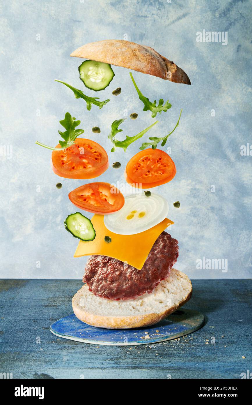 Flying ingredients burger hi-res stock photography and images - Alamy
