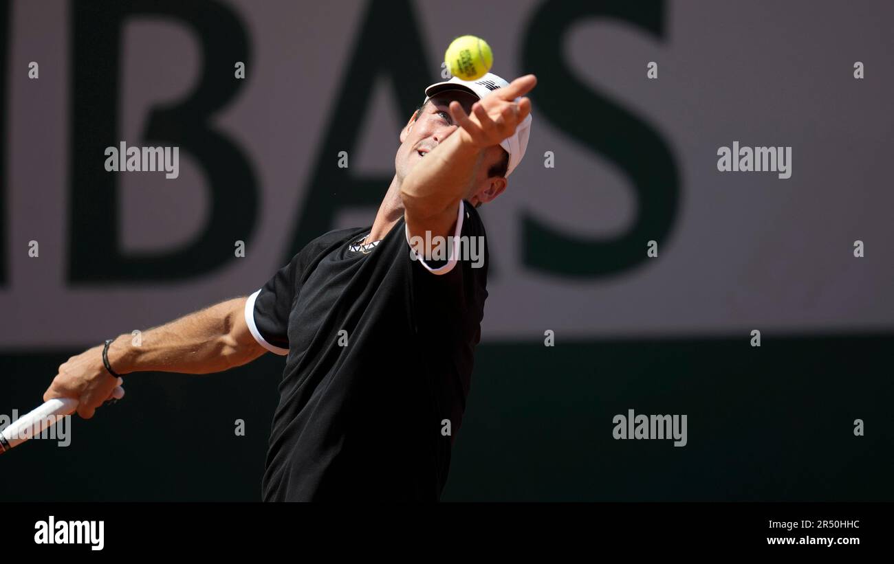 Tommy Paul of the U.S. serves against Switzerland's Dominic Stephan ...
