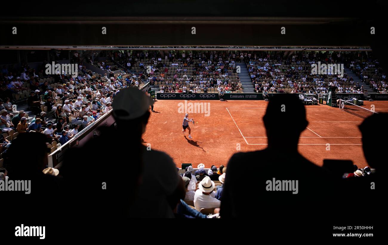 Spectators watch the first round match between Denmark's Holger Rune ...
