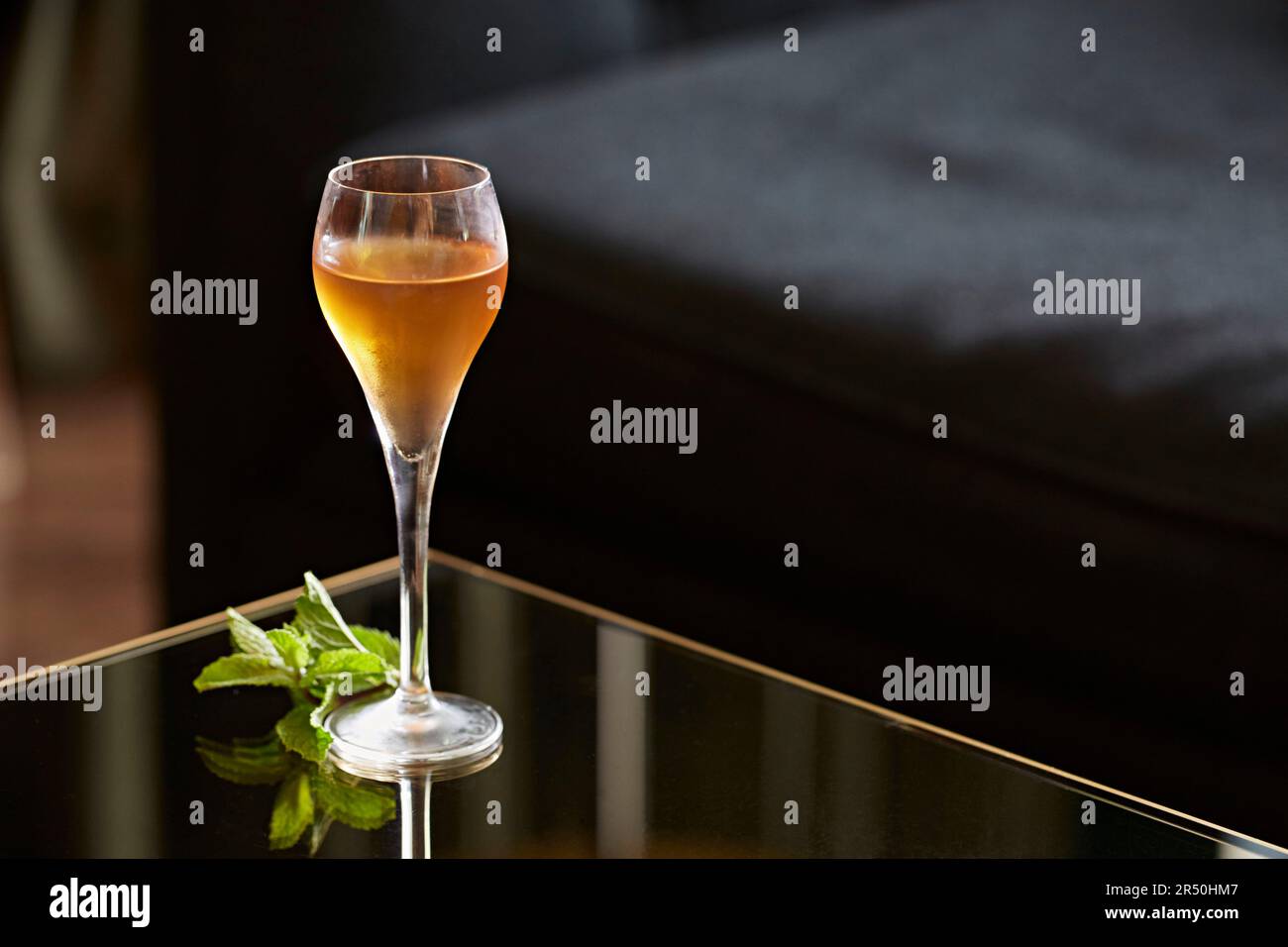 Cocktail served in a tulip champagne fliute Stock Photo - Alamy
