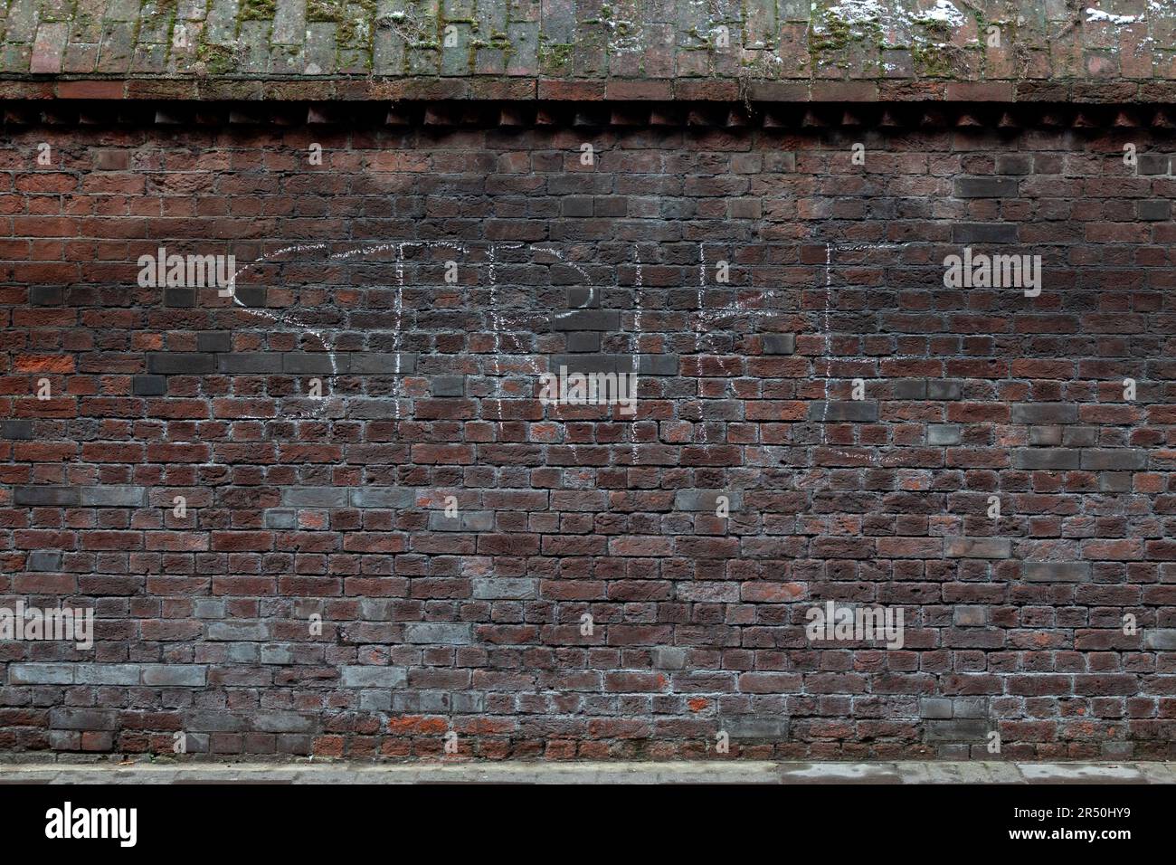 The word Strike has been chalked onto the wall of a college of ...
