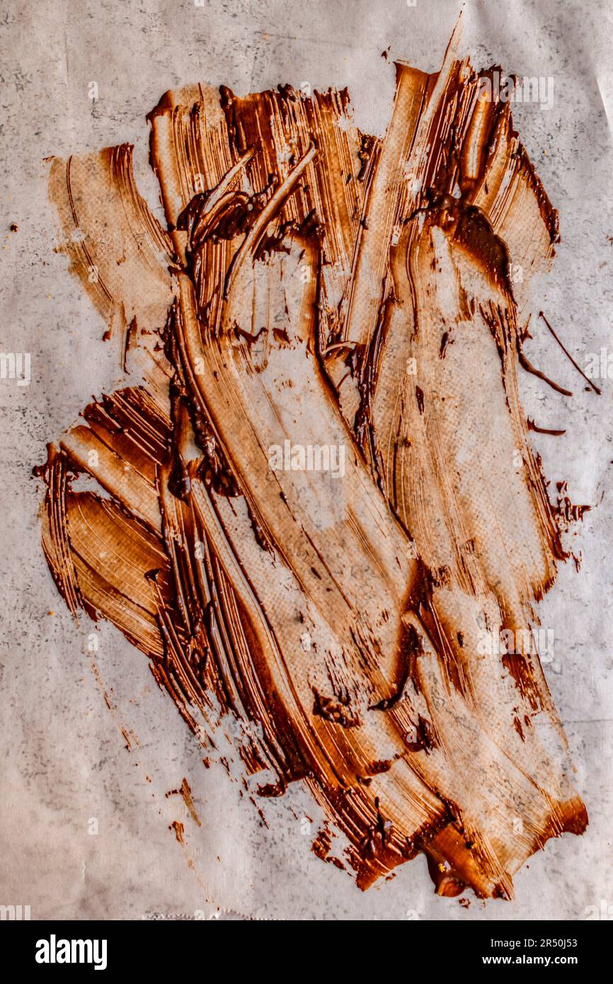 Smudged chocolate on parchment paper Stock Photo - Alamy