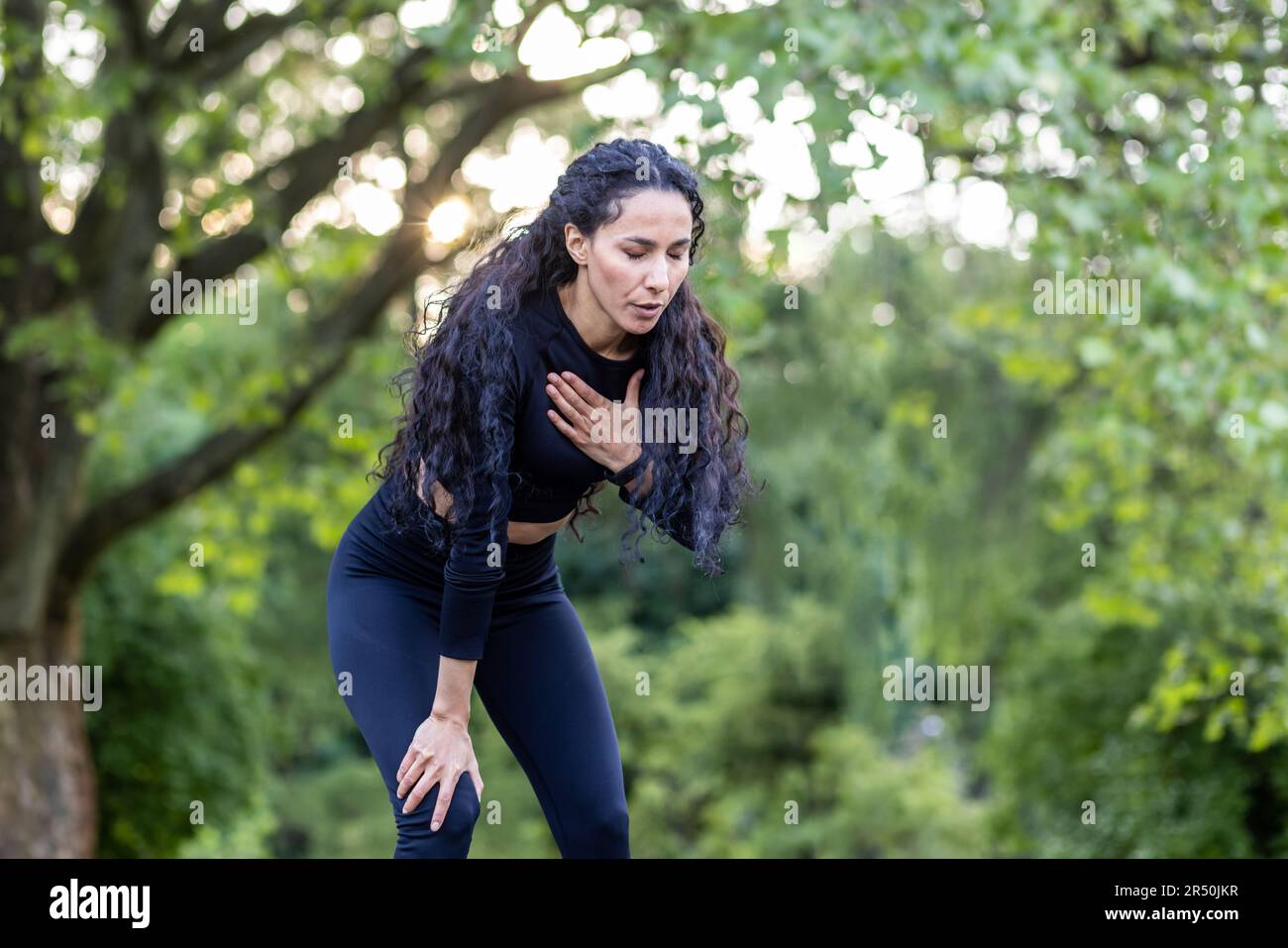 Portrait of a beautiful female athlete in the park, Hispanic woman ...