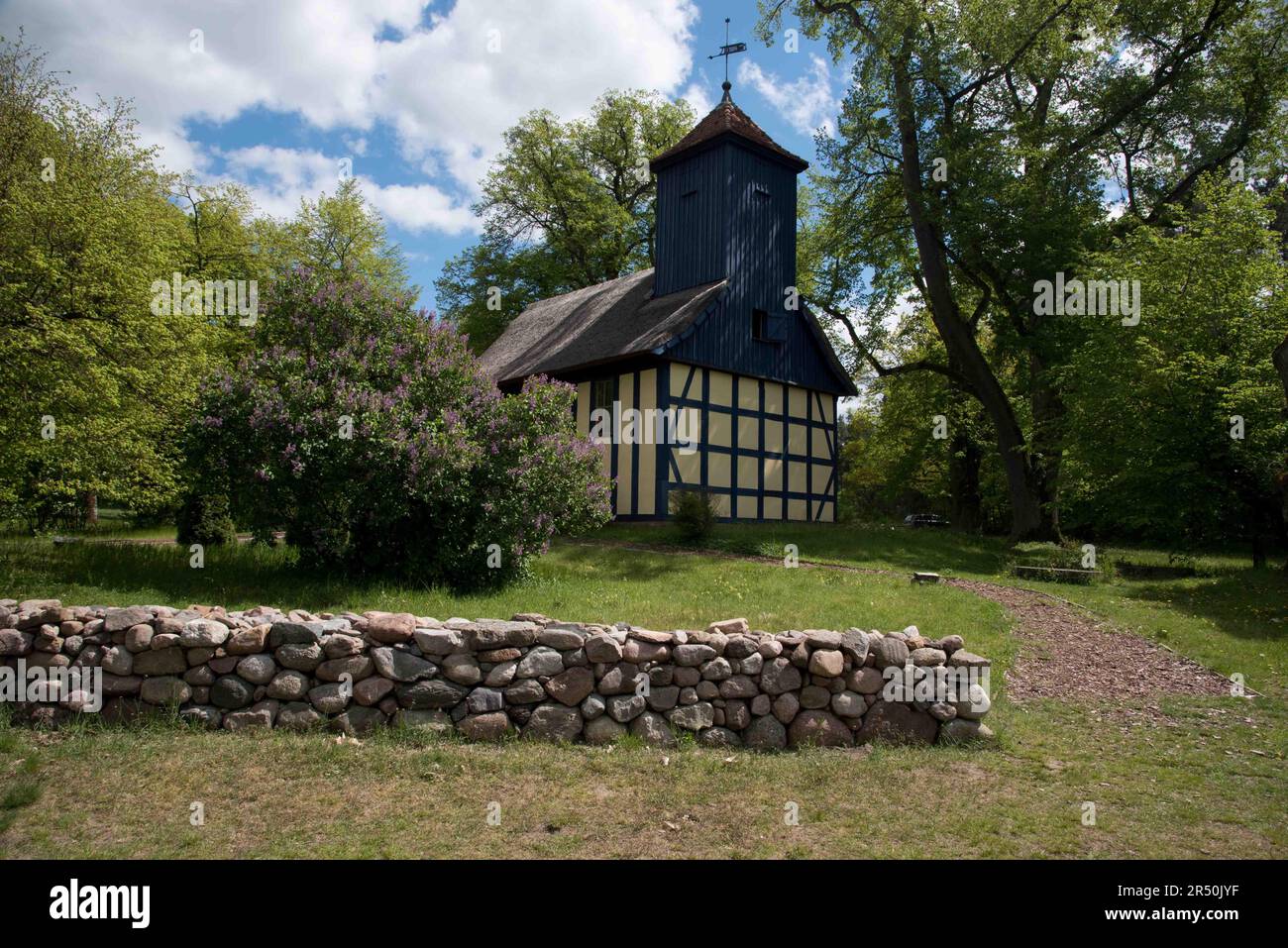small church in the green is a tiny timber framed and restored church ...