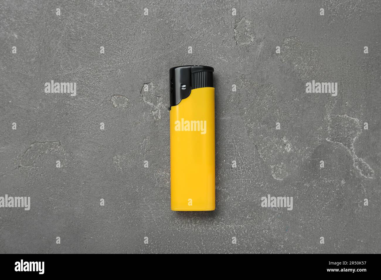 Stylish small pocket lighter on grey table, top view Stock Photo - Alamy