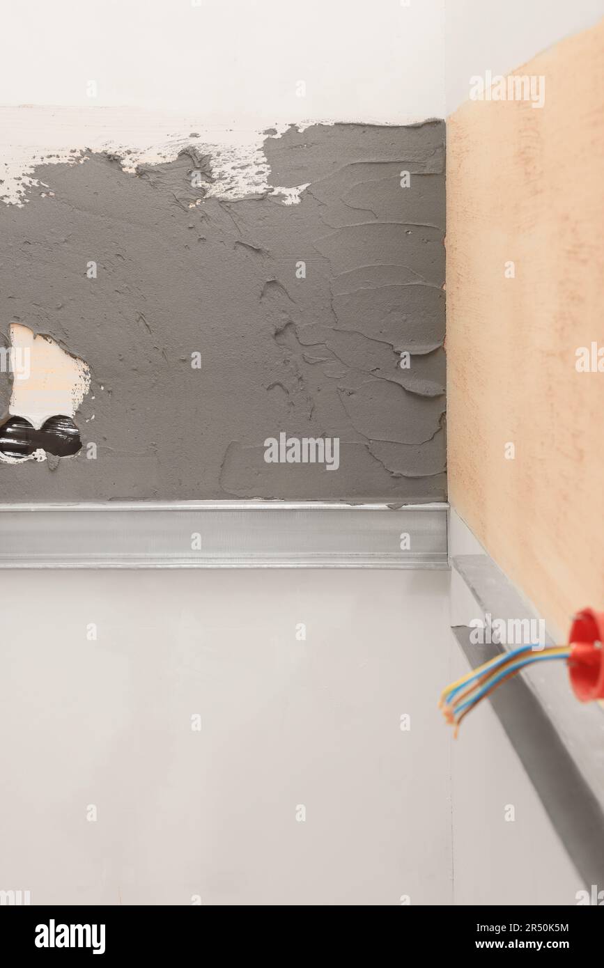 Adhesive mix for installing tile and socket holes on wall indoors Stock ...