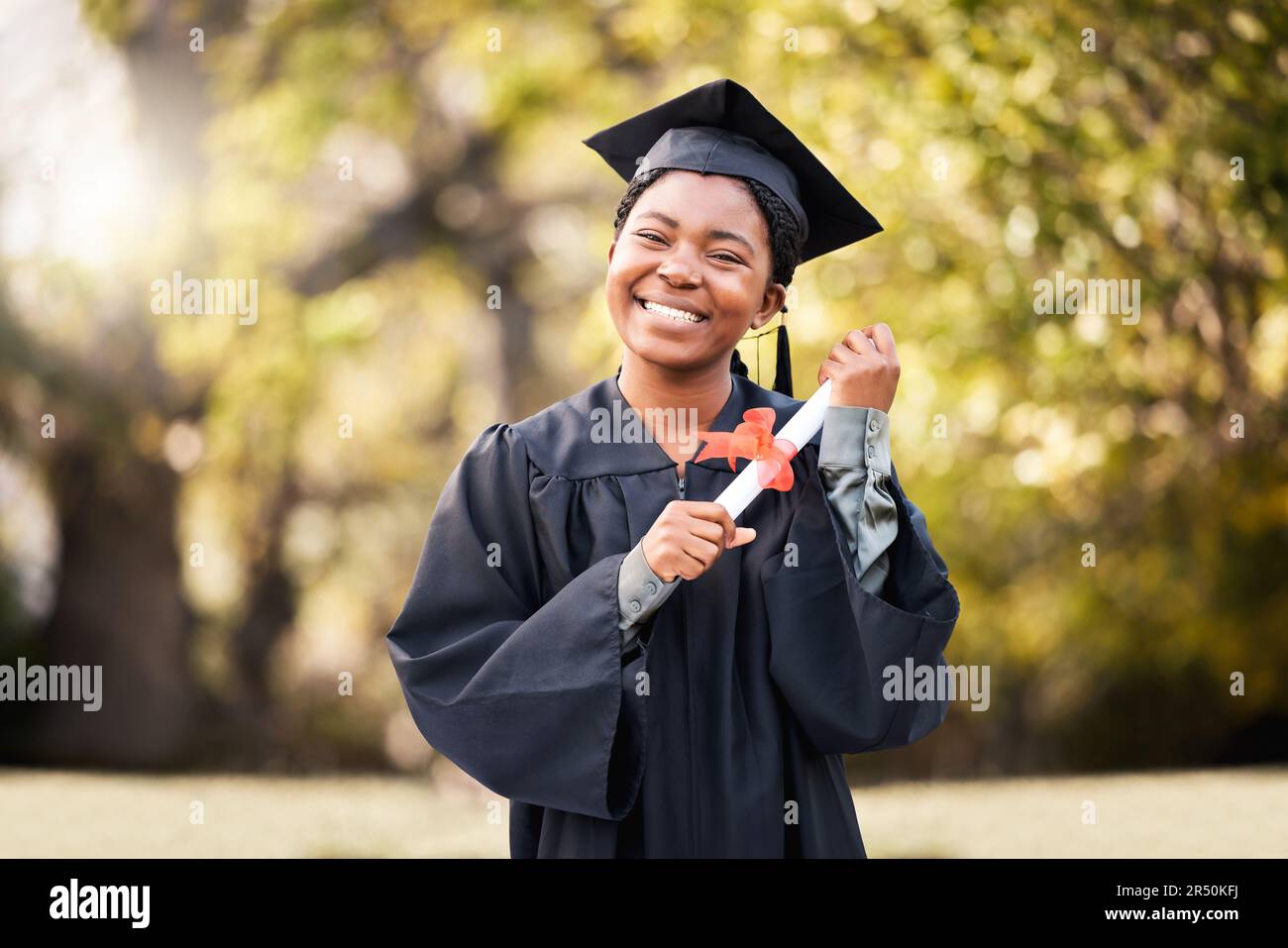 Portrait, graduation or qualification with a student black woman at a ...