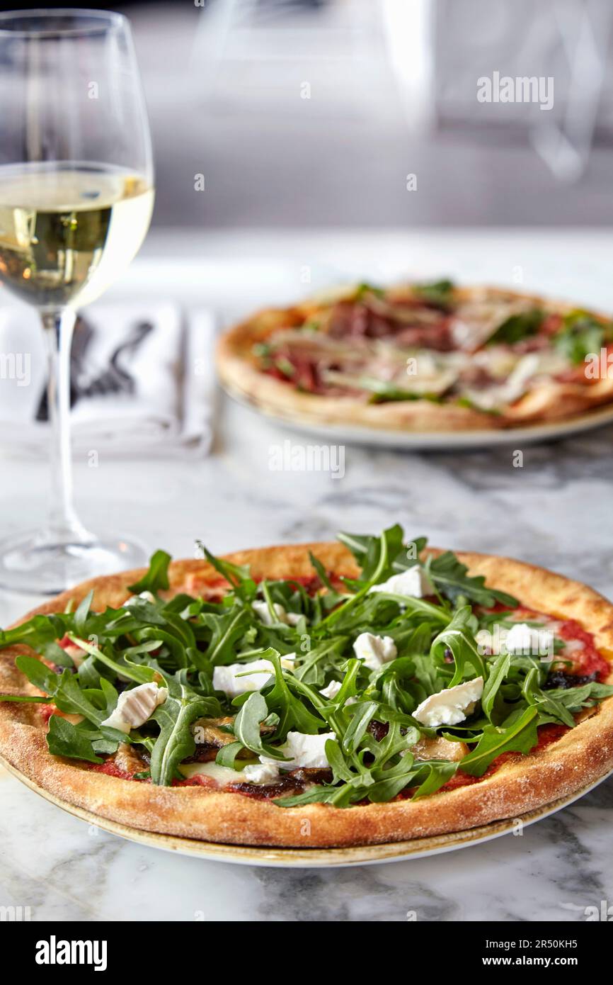 Pizza with rocket and cheese Stock Photo - Alamy