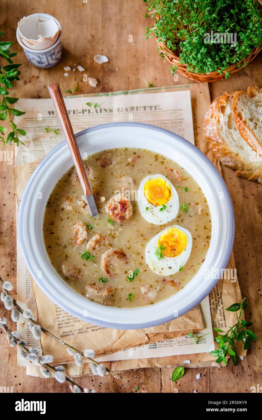 Easter sour rye soup with white sausage and egg Stock Photo - Alamy