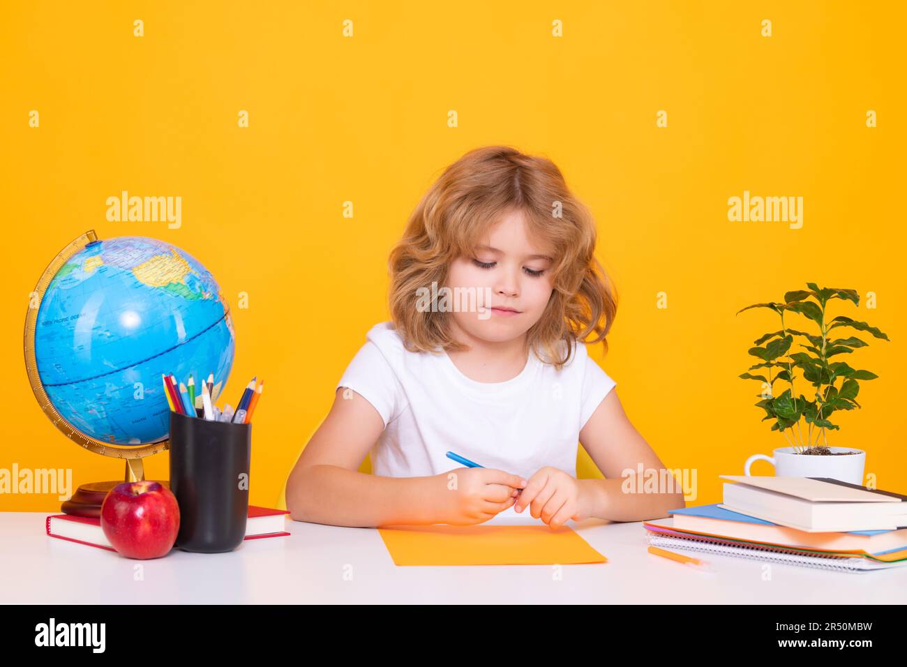 Child writing lesson. School kids. Child from elementary school. Pupil ...
