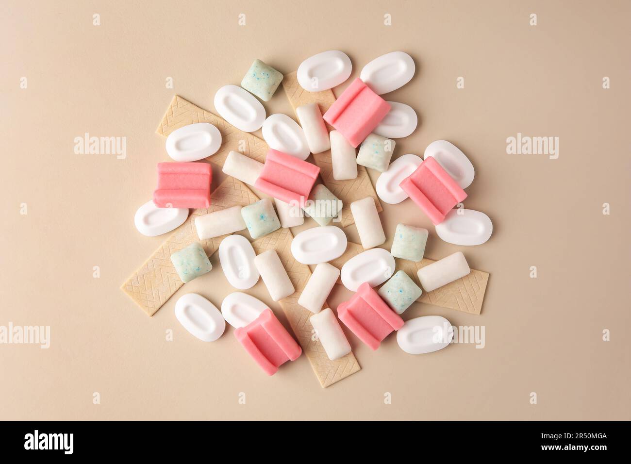 Many different chewing gums on beige background, flat lay Stock Photo ...