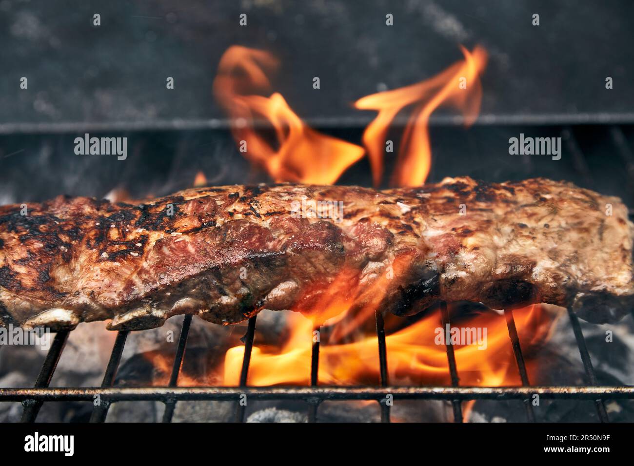 Beef on charcoal grill Stock Photo - Alamy