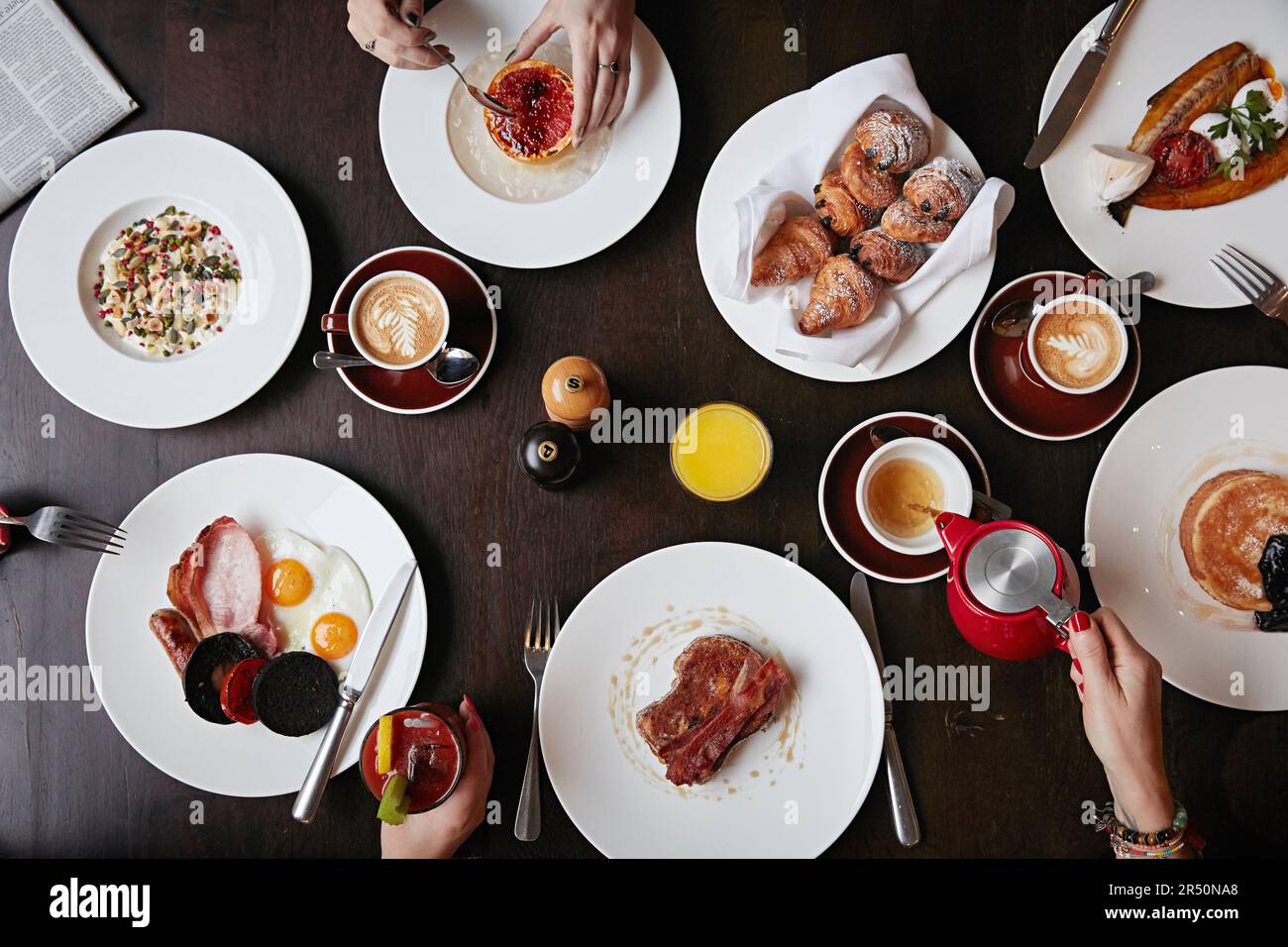 Breakfast table with people Stock Photo - Alamy