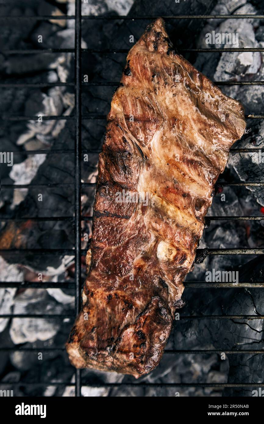 Beef on charcoal grill Stock Photo - Alamy
