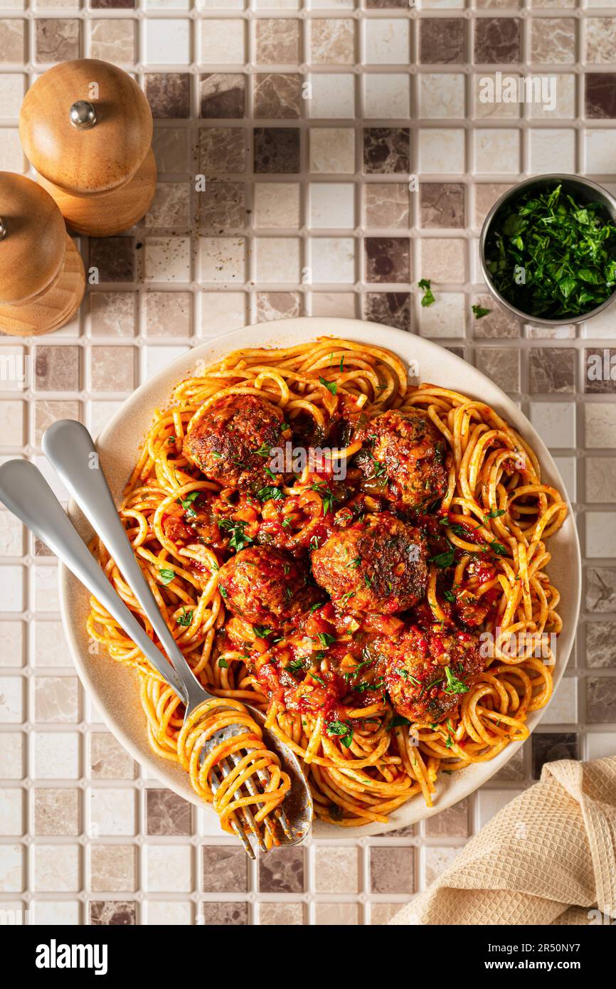 Meatballs in tomato sauce with spaghetti on a plate Stock Photo - Alamy