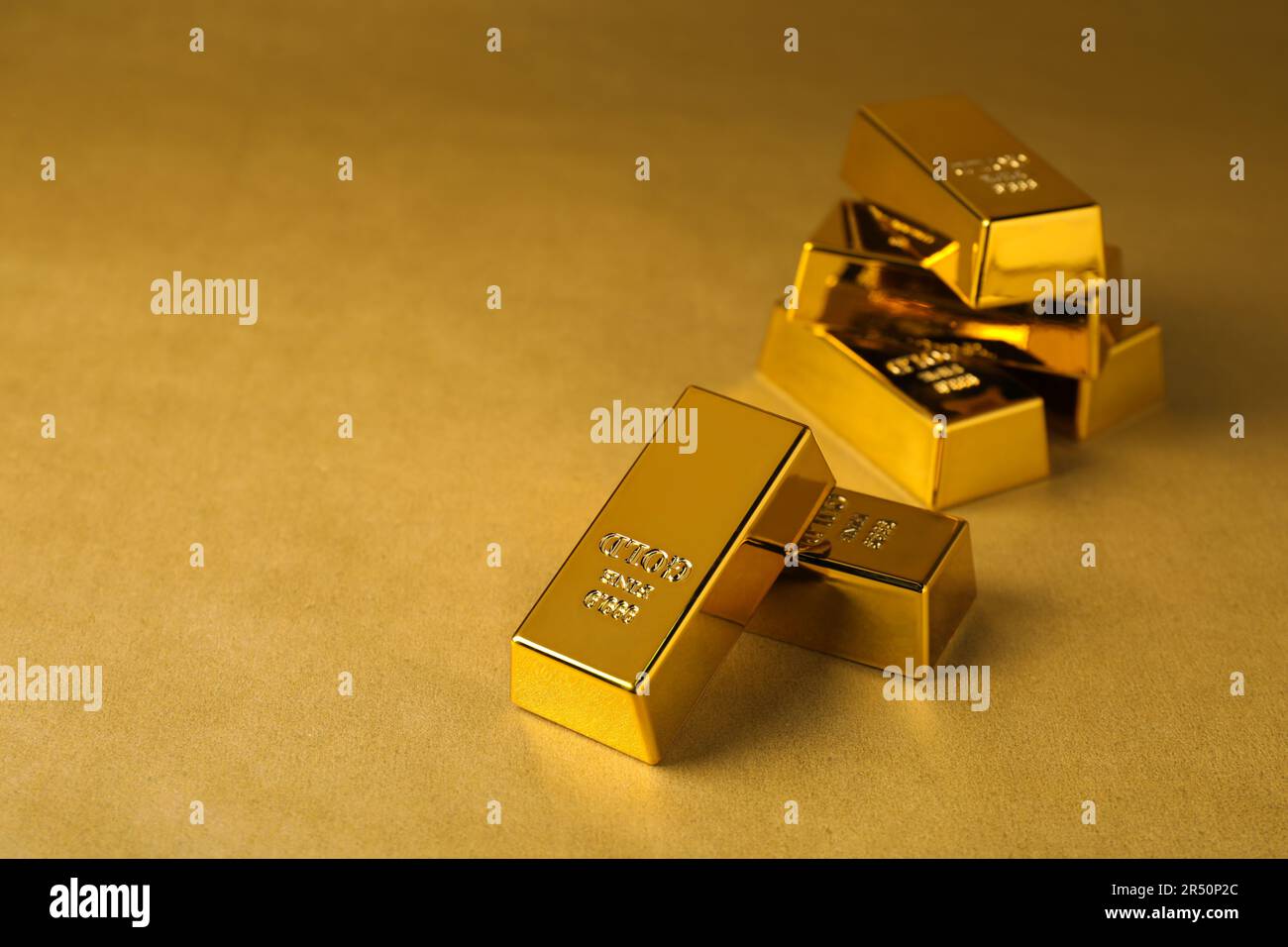 Many shiny gold bars on color background. Space for text Stock Photo - Alamy