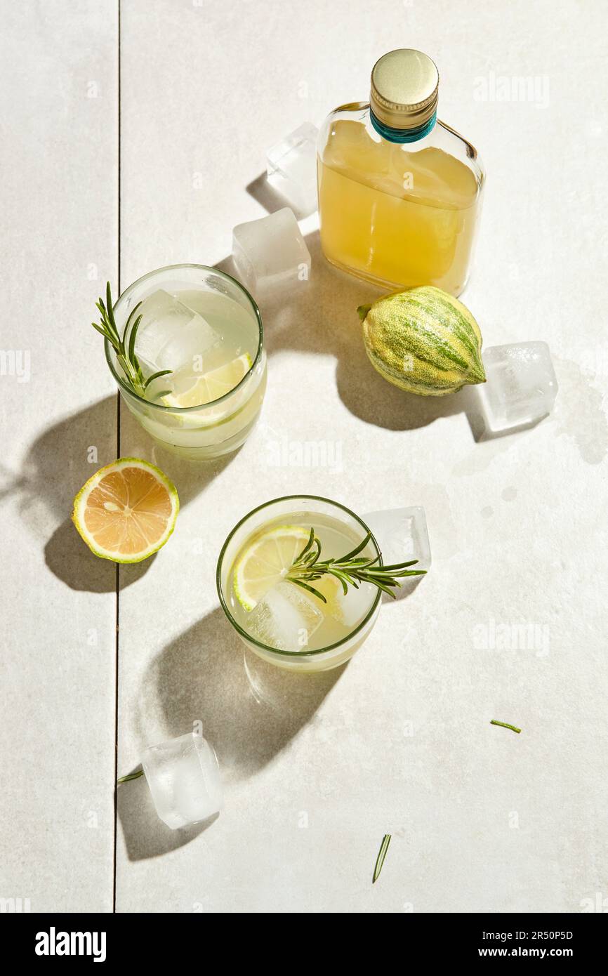 Homemade lemonade with tiger lemon ginger syrup, rosemary and ice cubes ...