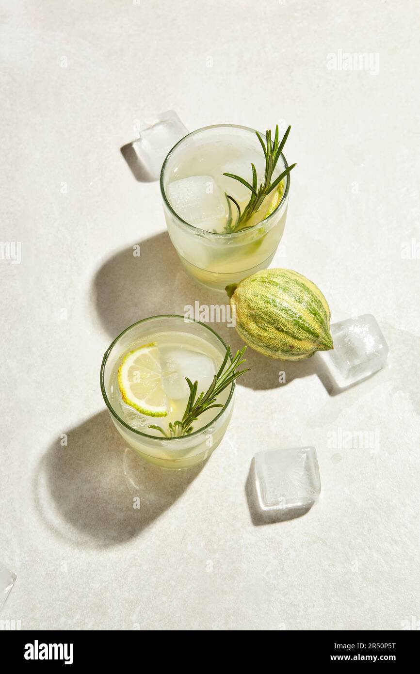 Homemade lemonade with tiger lemon ginger syrup, rosemary and ice cubes ...