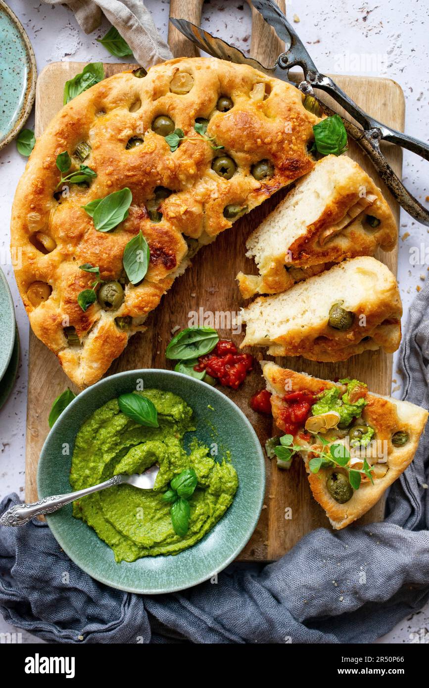 Focaccia with basil sauce Stock Photo - Alamy