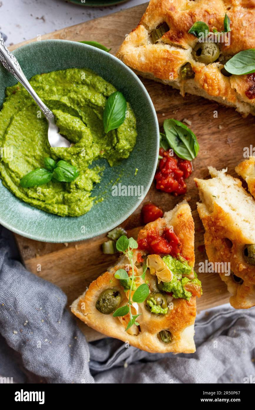 Focaccia with basil sauce Stock Photo - Alamy
