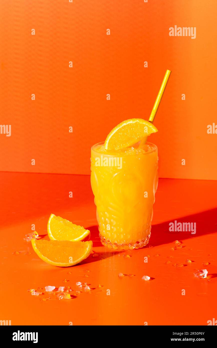 Orange juice on ice Stock Photo - Alamy