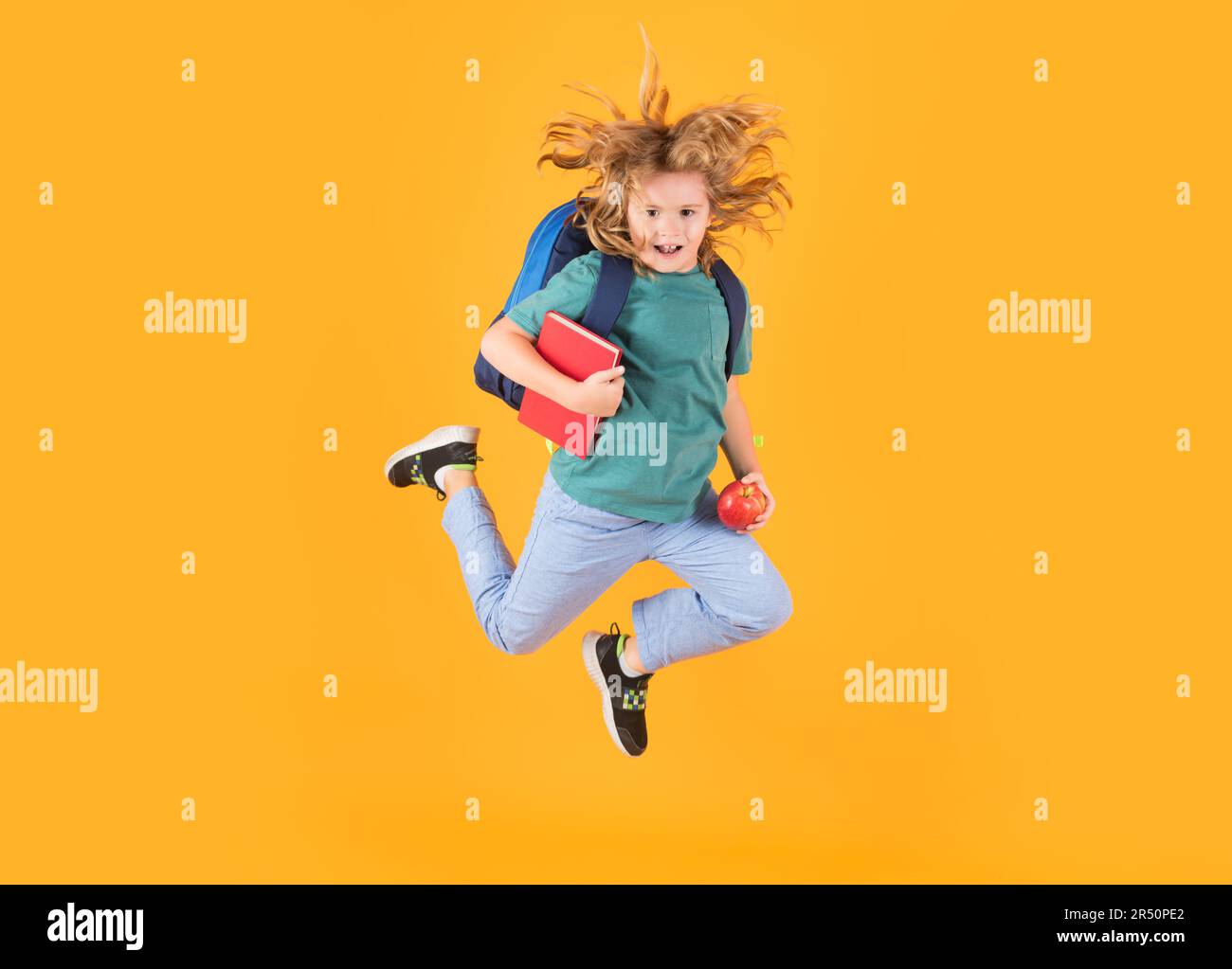 Back to school. Full length body of cheerful school child jumping ...