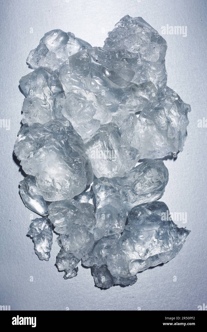 Ice cubes on a grey background Stock Photo - Alamy