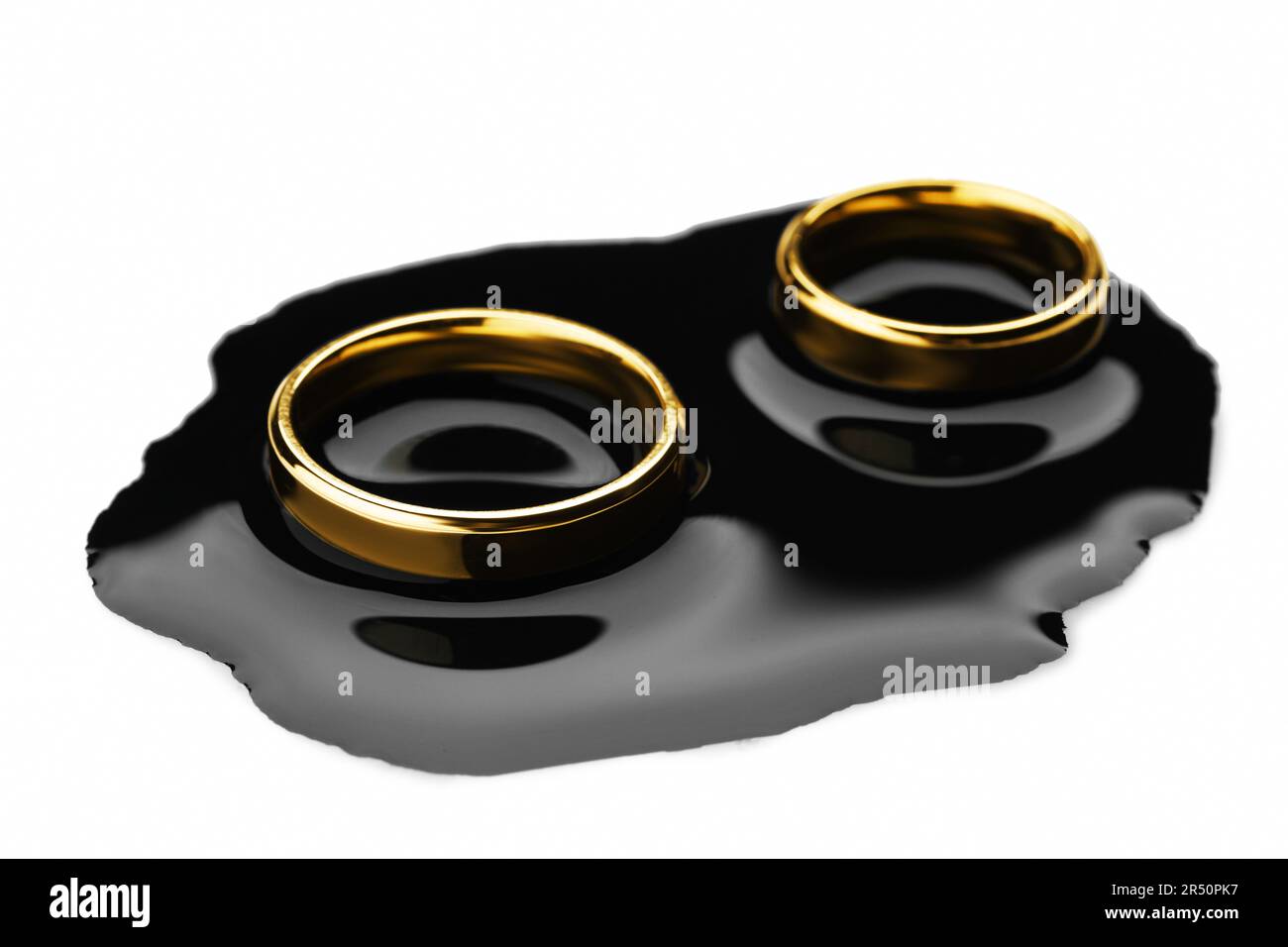Divorce concept. Wedding rings with black ink on white background Stock ...