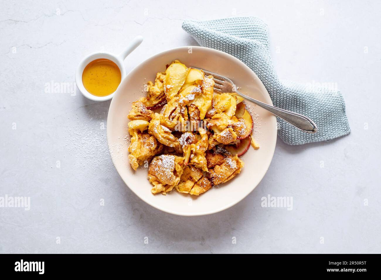 Kaiserschmarrn (shredded pancakes) with apricot sauce Stock Photo - Alamy