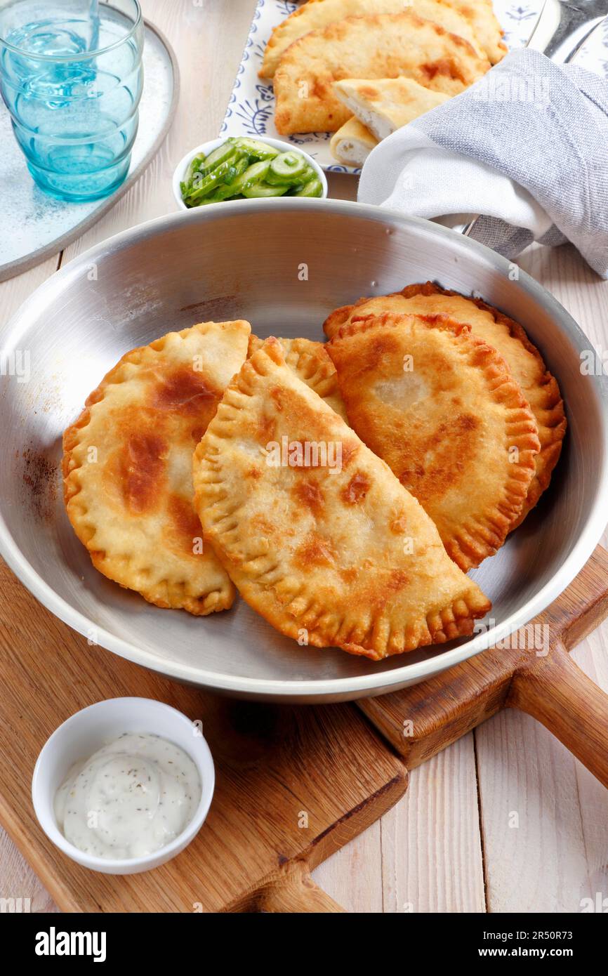 Deep fried Chebureki (dumplings with meat filling, Russia Stock Photo ...