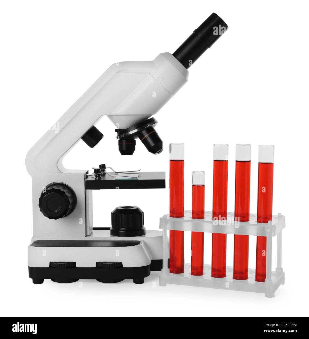 Test tubes with red liquid and microscope isolated on white Stock Photo ...