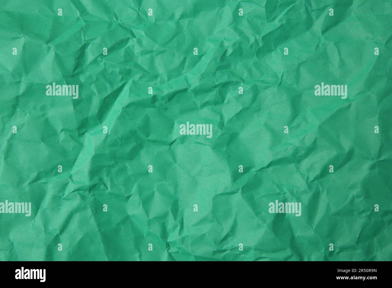 Sheet of crumpled green paper as background, top view Stock Photo - Alamy