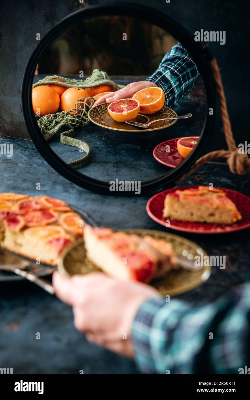 Cake with blood orange (false reflection in the mirror Stock Photo - Alamy