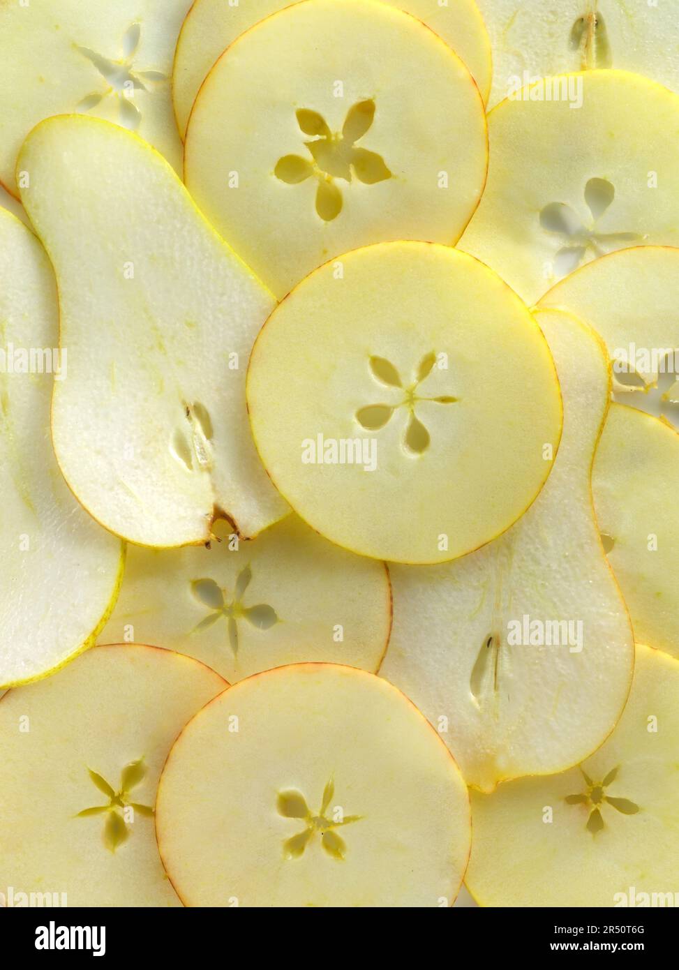 Apples and pears cut into thin slices (picture-filling Stock Photo - Alamy