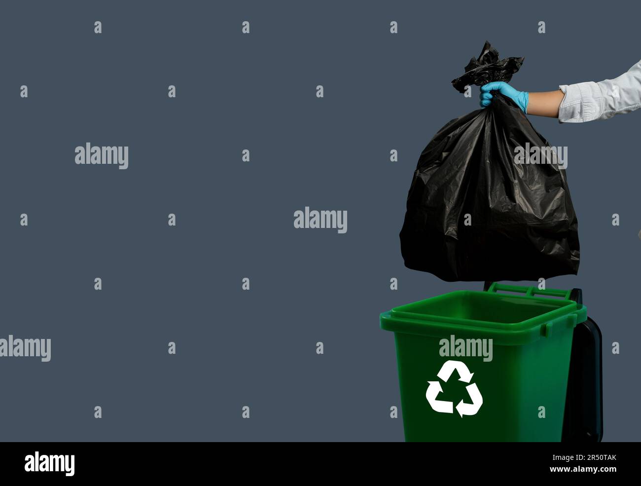 male person hand holding garbage black to bin trash full junk plastic ...