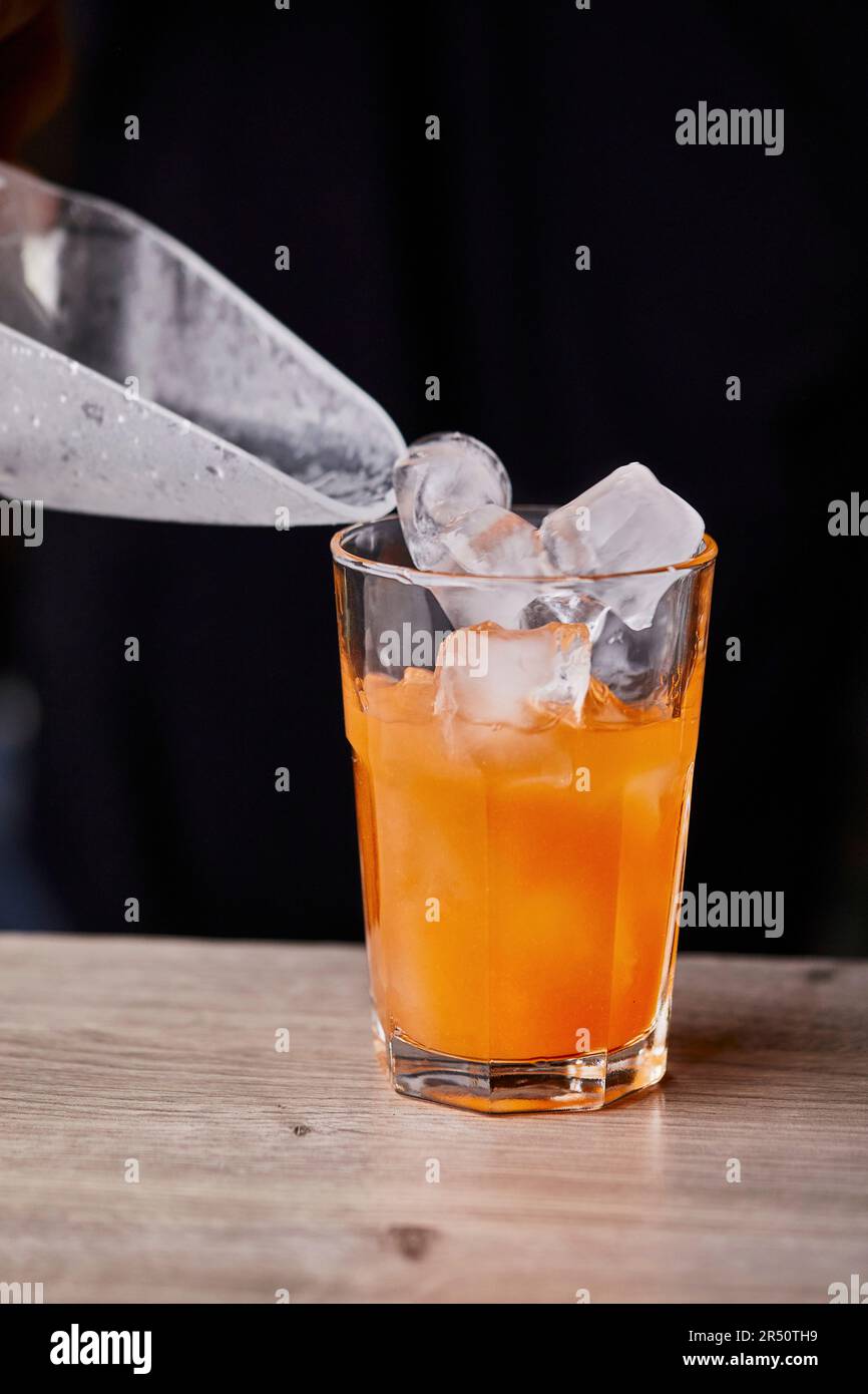 Mixing a watermelon cocktail - Adding crushed ice Stock Photo - Alamy