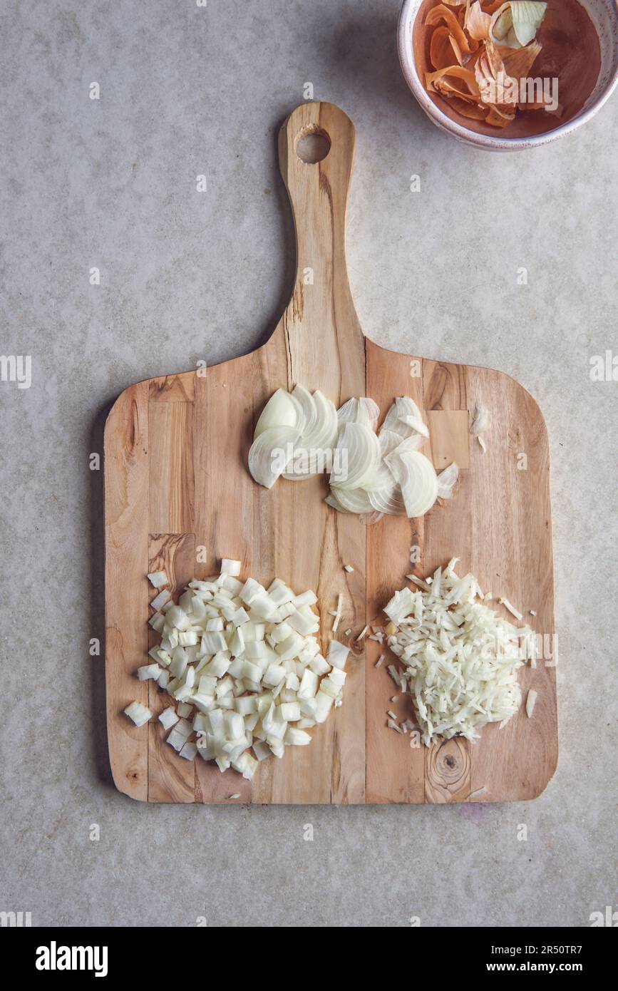 Onion cut into half moon sices, brunoise, and diced Stock Photo - Alamy