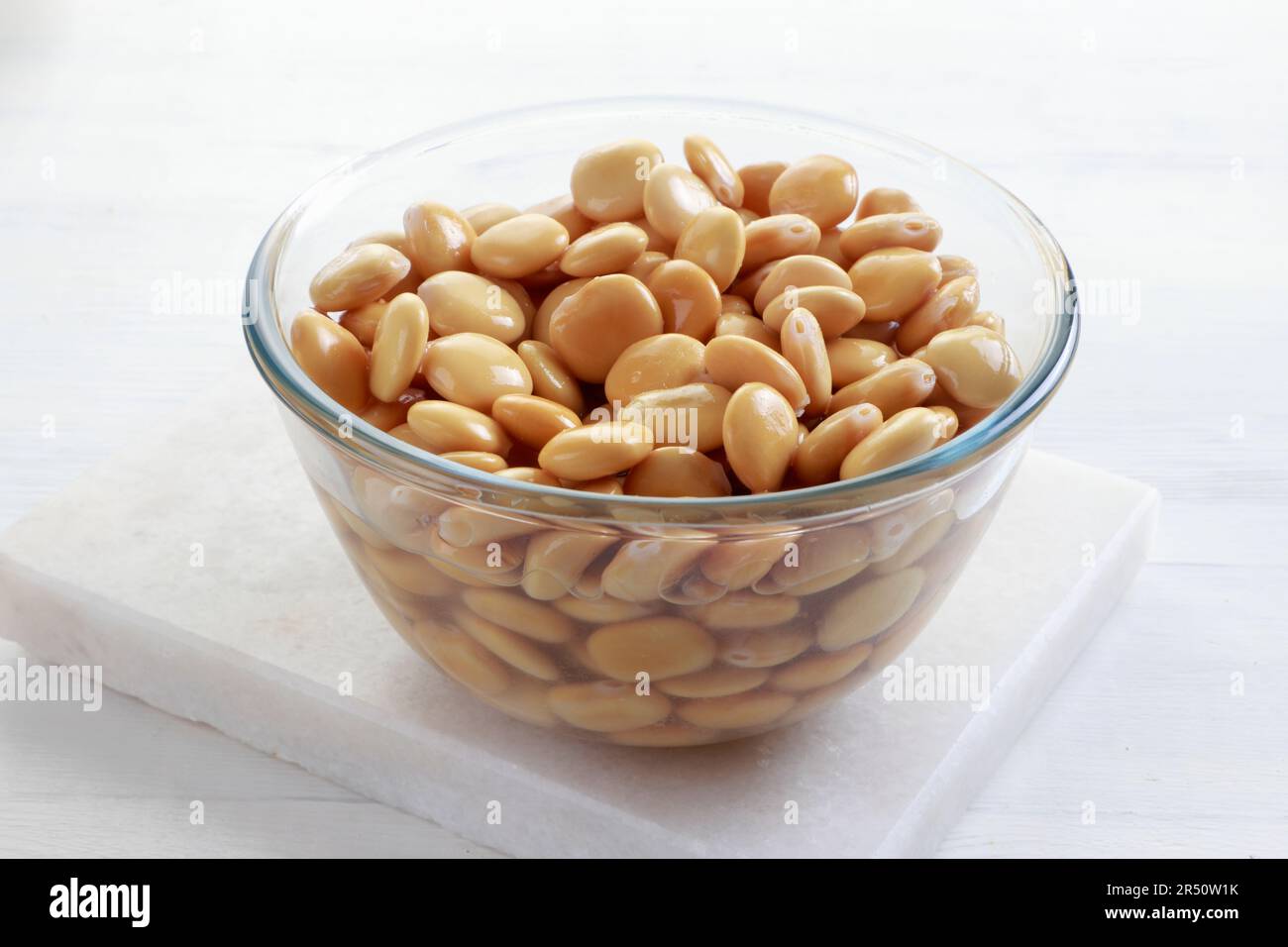 Lupin beans as a snack in a bowl Stock Photo - Alamy