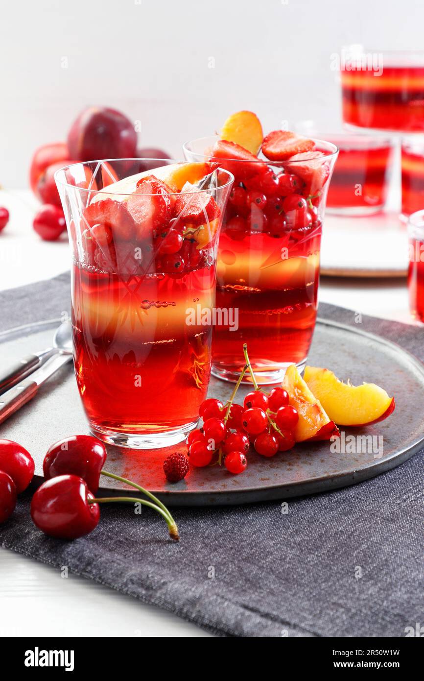 Dessert of jelly layers with fresh fruit Stock Photo - Alamy