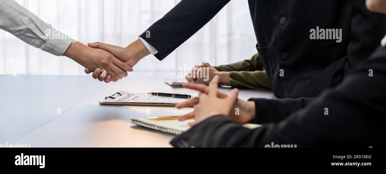 Interviewer handshaking the applicant hi-res stock photography and ...