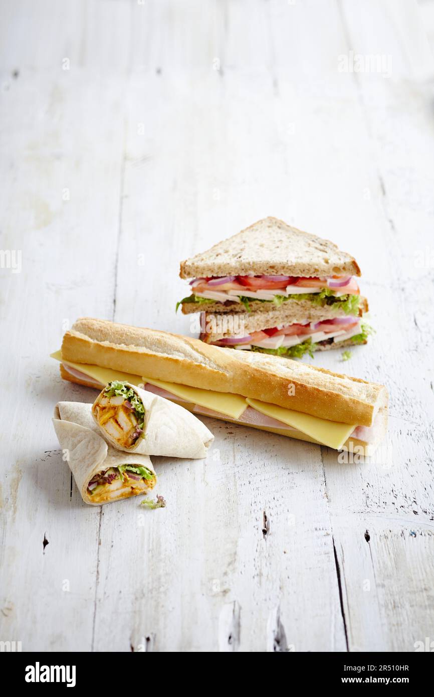 Selection of deli wraps, baguette and sandwhiches filled with chicken ...