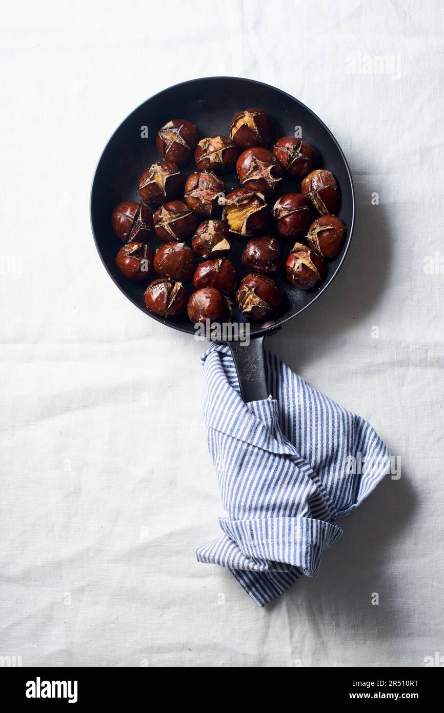 Chestnuts roasted in a frying pan hi-res stock photography and images ...