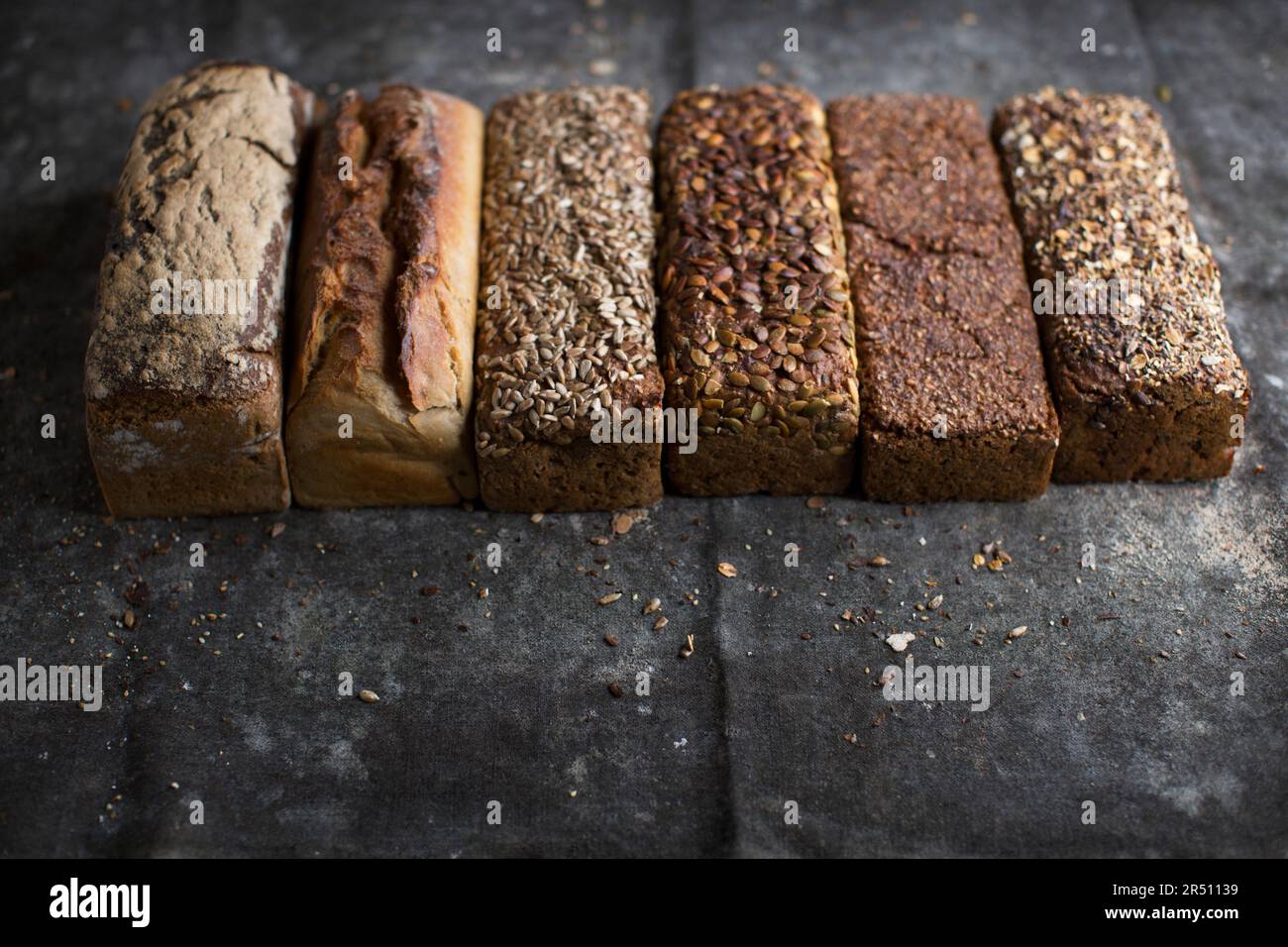 Various loaves in a row Stock Photo - Alamy