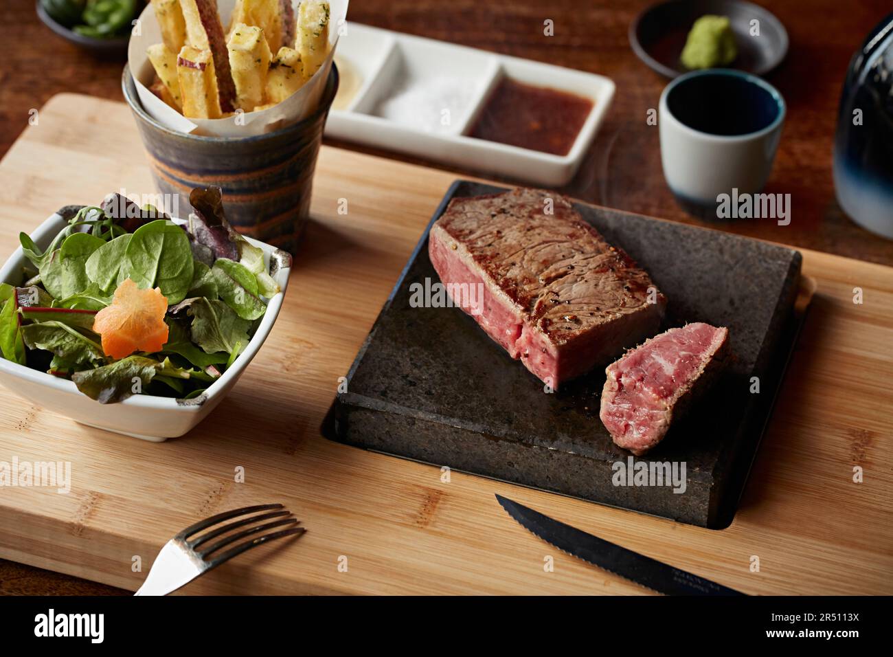 Wagyu beef on hot lava stone Stock Photo - Alamy