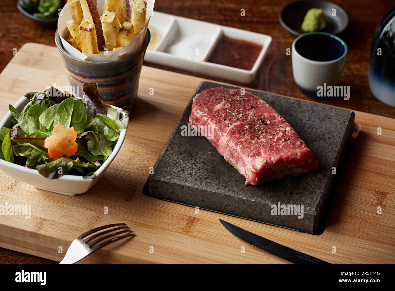Raw Wagyu beef on hot lava stone Stock Photo - Alamy