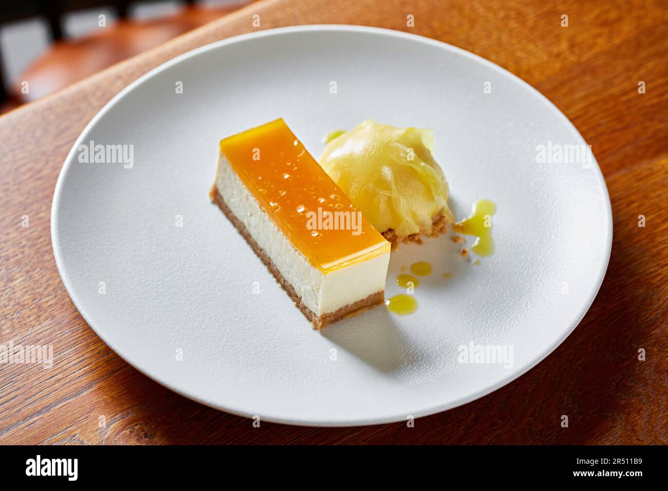 Slice of Passion fruit cheesecake Stock Photo - Alamy