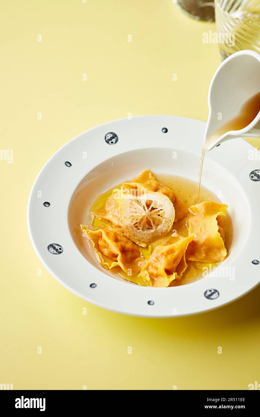 Crispy raviolli in a light broth Stock Photo - Alamy